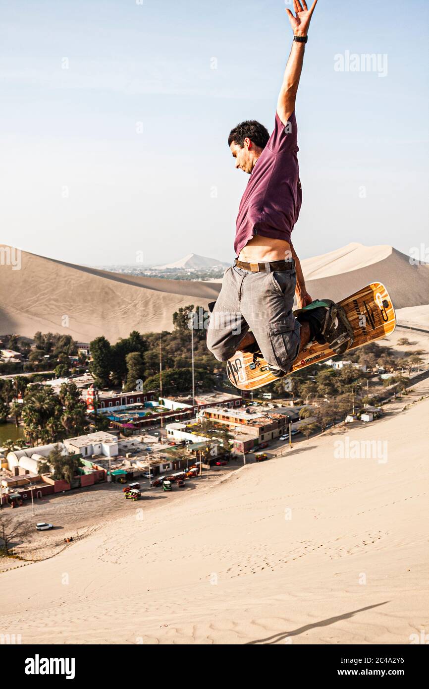 Sandboarding in Huacachina. Ica, Department of Ica, Peru Stock Photo ...
