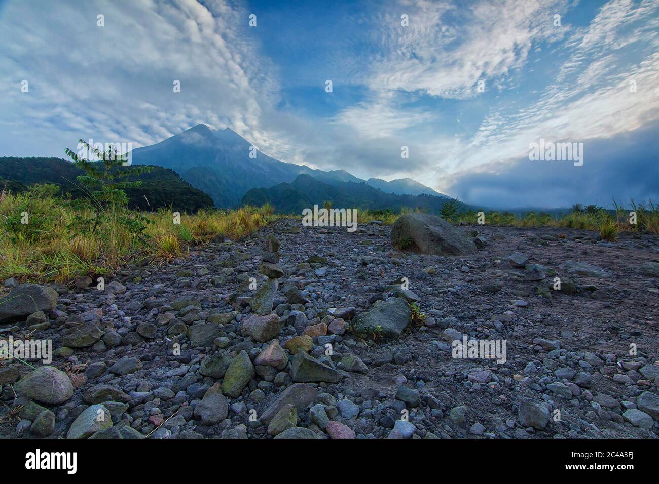 Beautiful stone stacking art as a foreground to the magnificent Mount ...