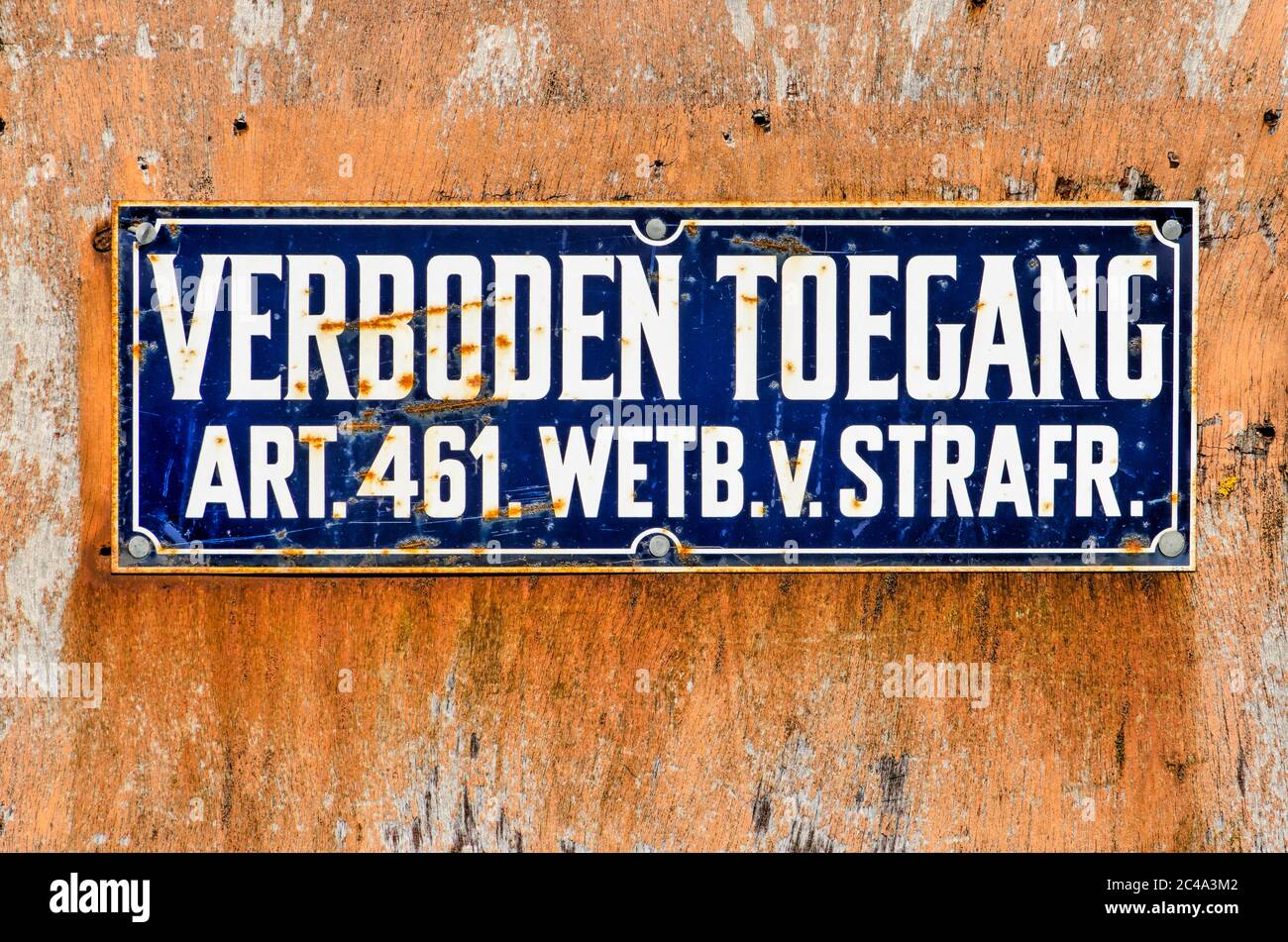 Slightly rusty sign with in Dutch the words "forbidden entry" on a ...