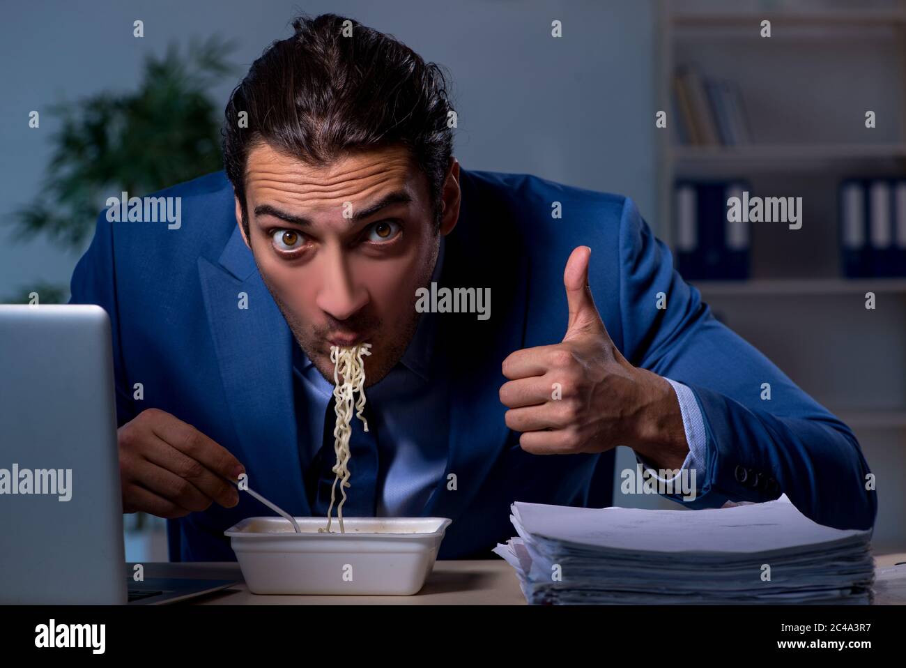 Work at night eat at desk hi-res stock photography and images - Alamy
