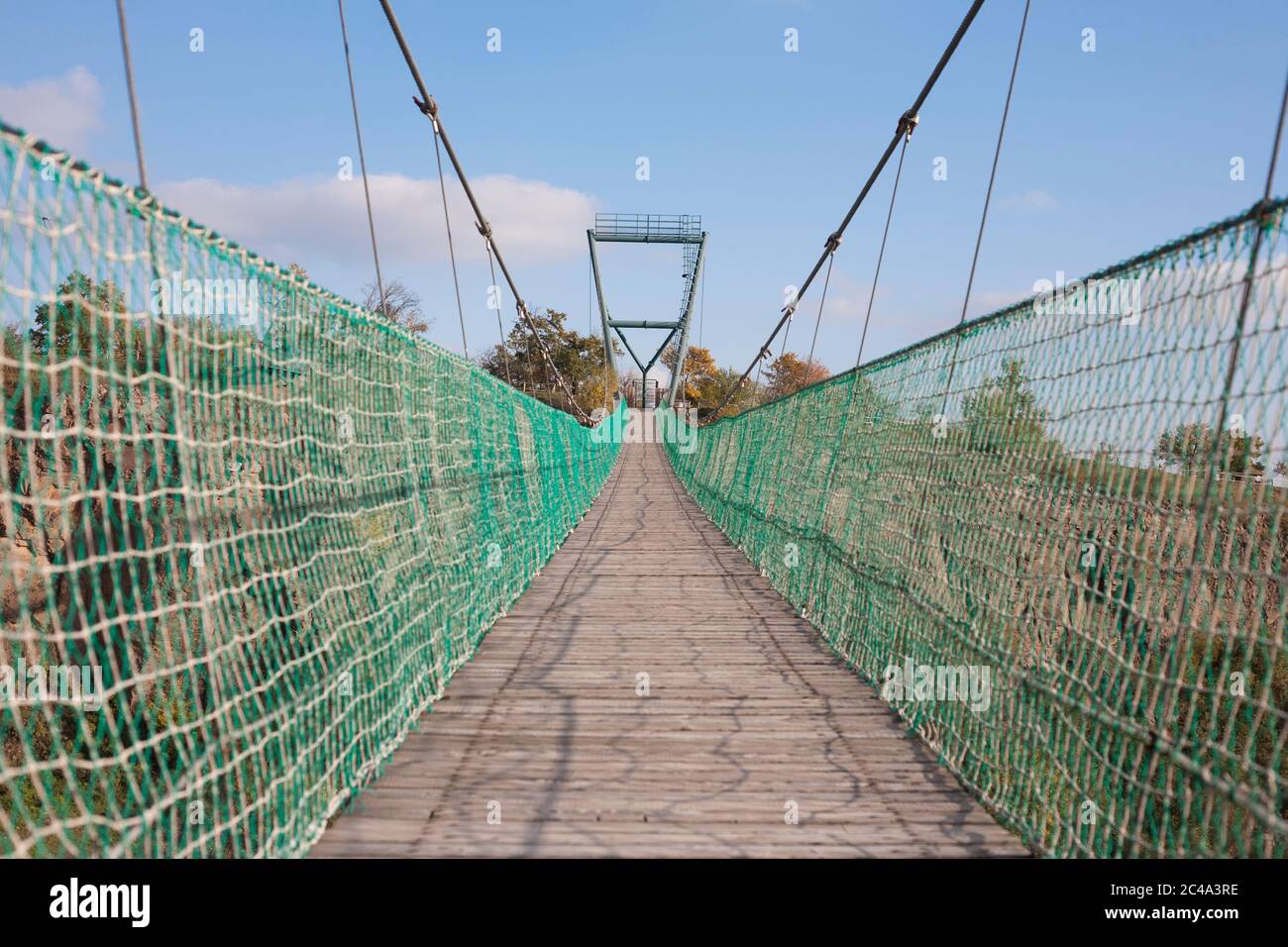 Rope suspension bridge over a gap Stock Photo - Alamy