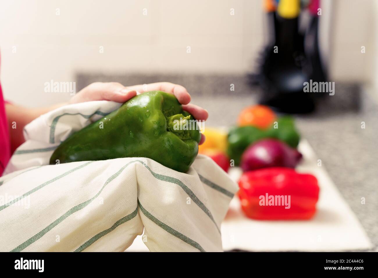 Cleaning the fruits and vegetables with a towel for the coronavirus ...