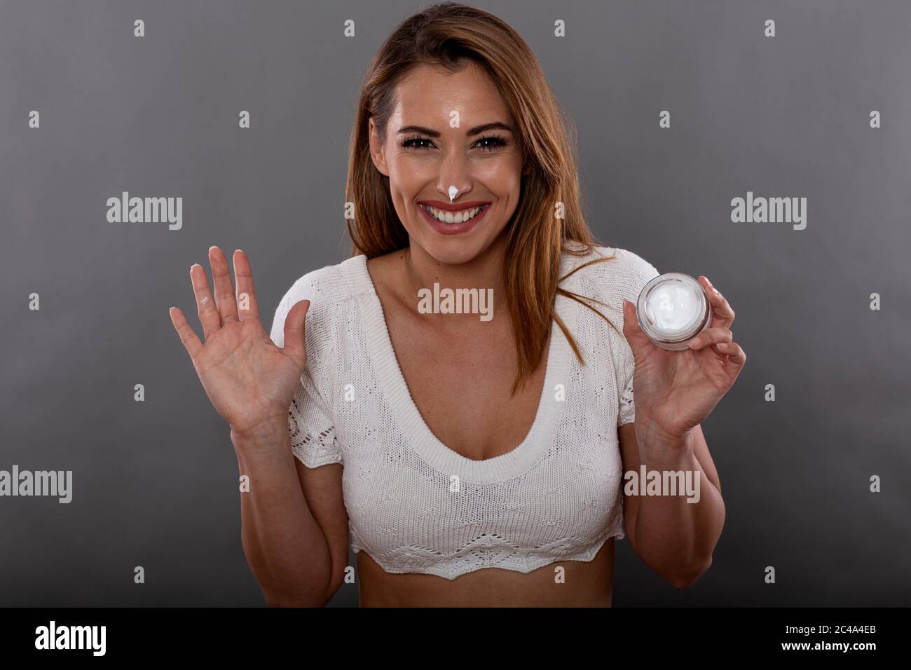Young woman havin fun with skin care Stock Photo - Alamy