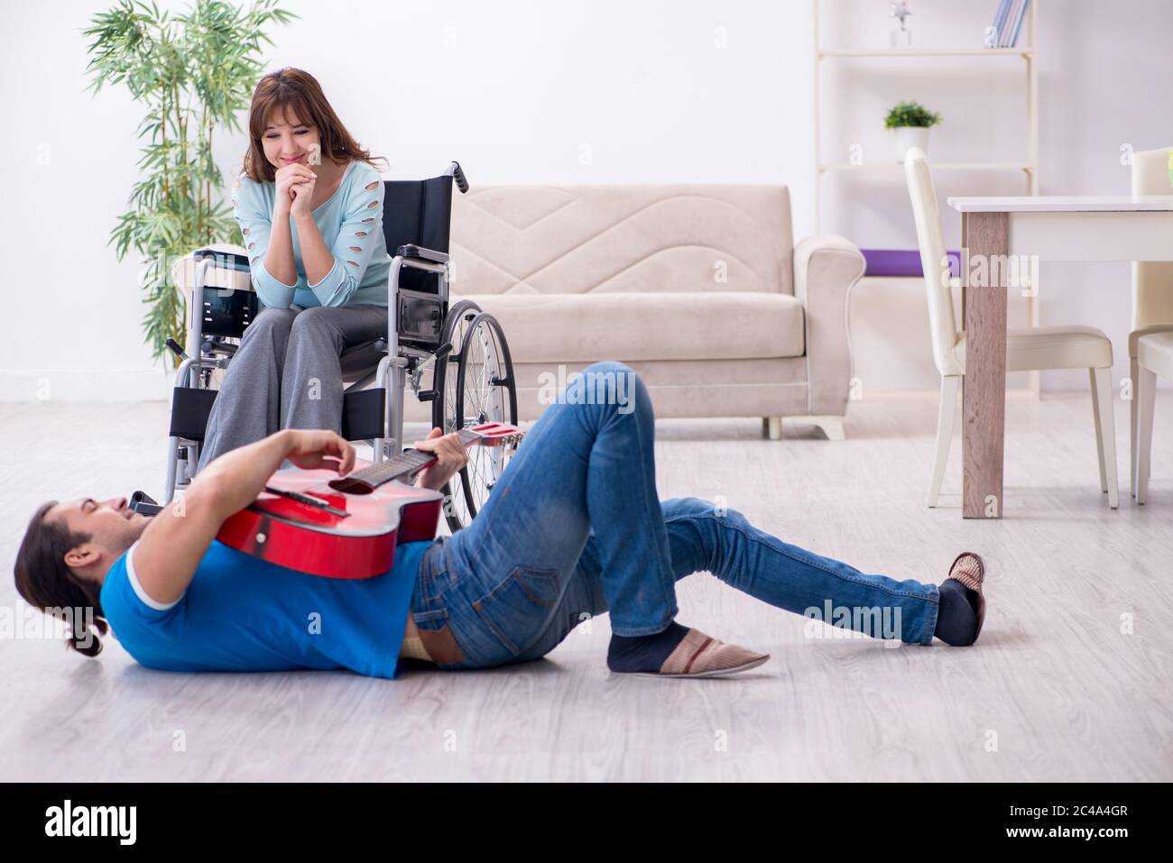 Disabled wife and husband at home Stock Photo - Alamy