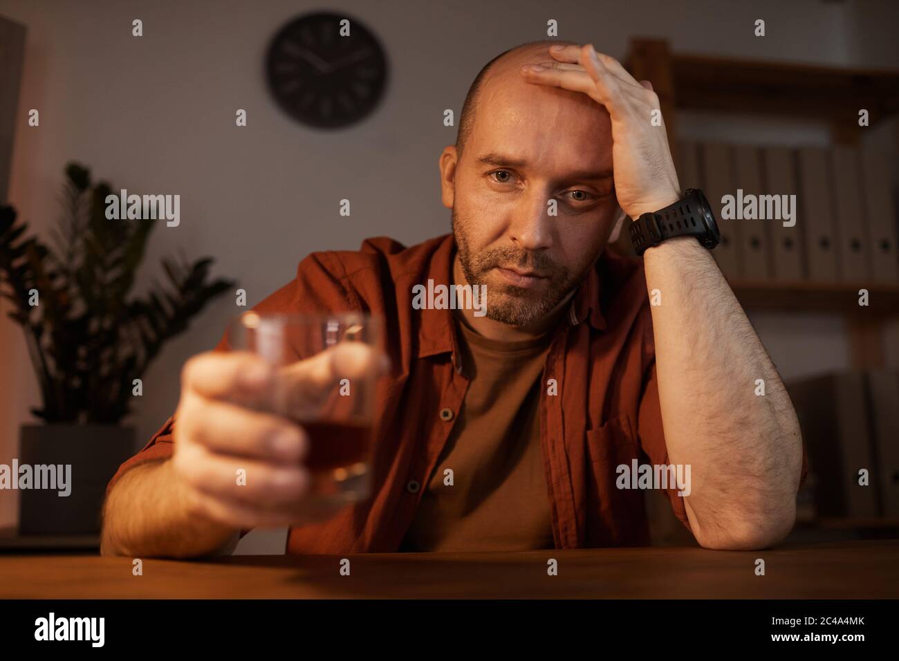 Sad looking men sitting table hi-res stock photography and images - Alamy