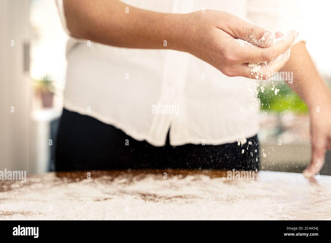 Sprinkling powder hands hi-res stock photography and images - Alamy