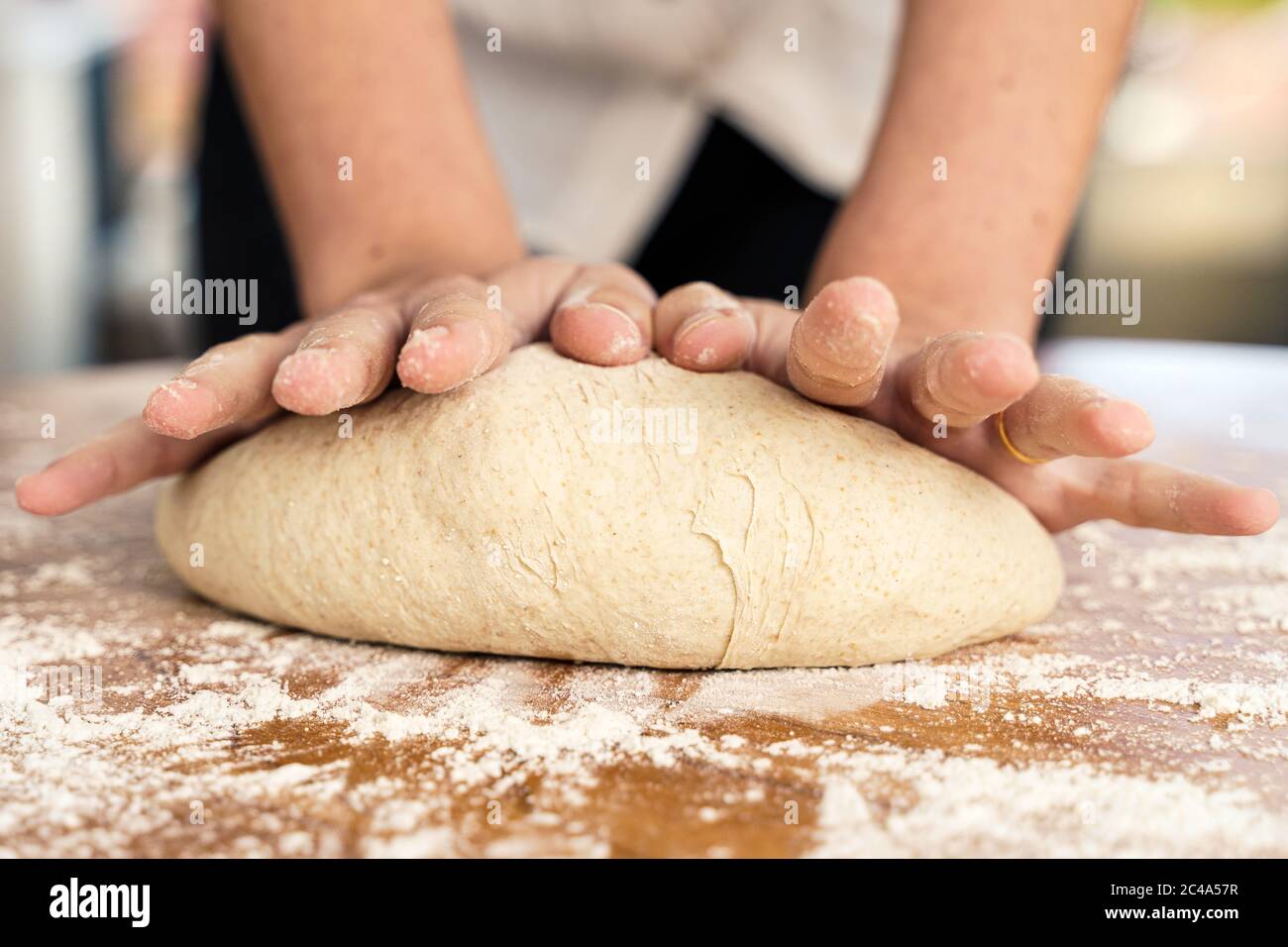 Woman kneading bread dough hi-res stock photography and images - Alamy