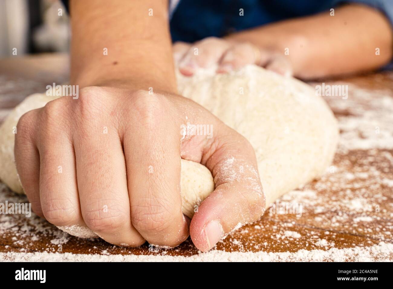 Baker kneading dough counter hi-res stock photography and images - Alamy