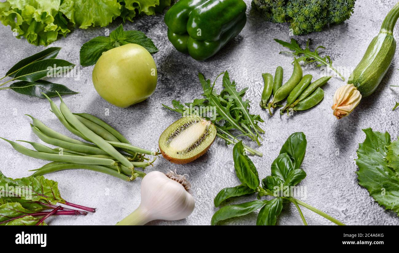 Flat lay series of assorted green toned vegetables, fresh organic raw ...
