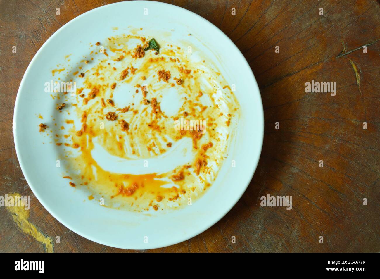 food stain with smiling face on white dish Stock Photo - Alamy