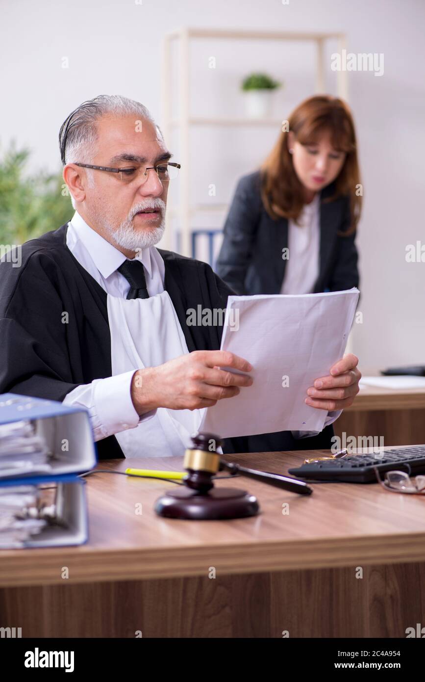Old judge and his young secretary in the office Stock Photo - Alamy