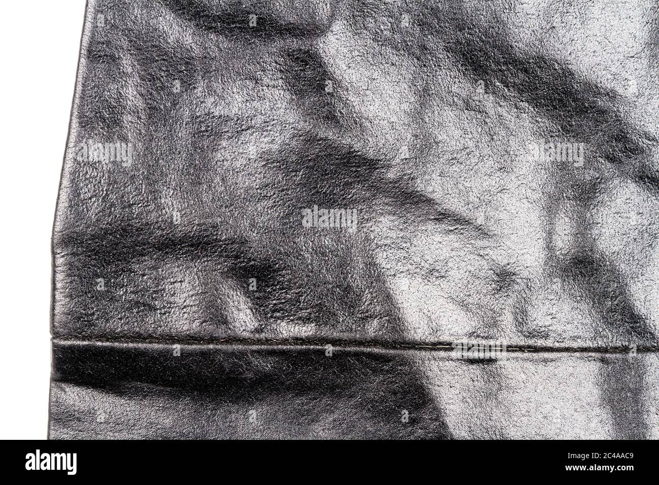 Piece of black leather isolated on white background. Crumpled material ...