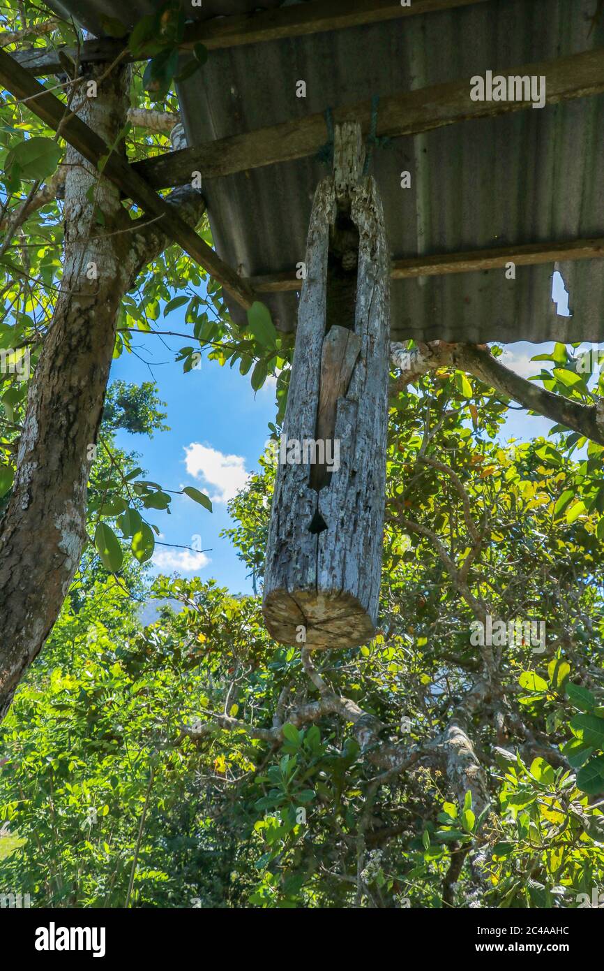 Wooden bells kulkul. A wooden bell with a mallet made from a tree trunk ...