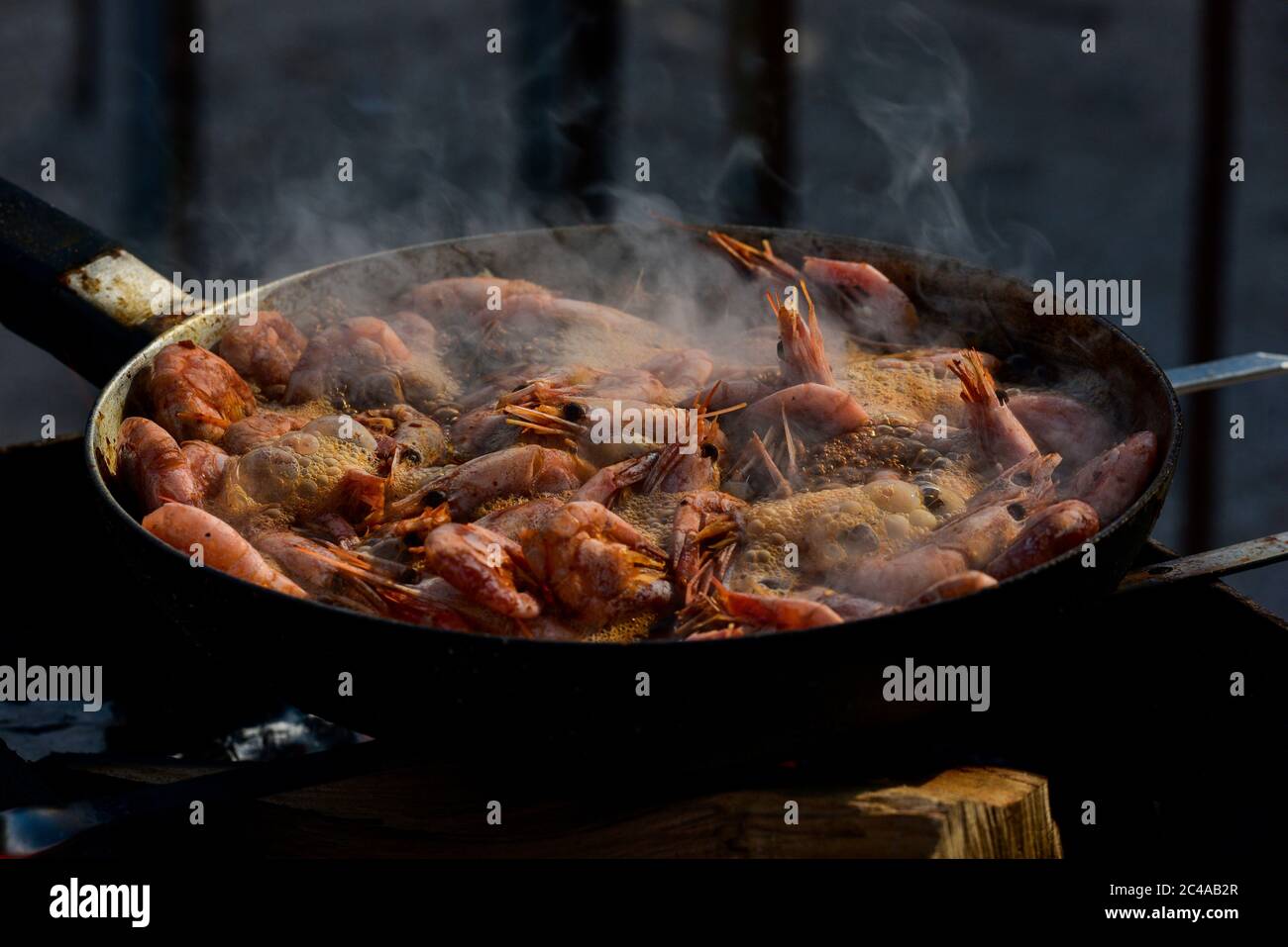 shrimp. Shrimps are cooked in a pan over a fire Stock Photo - Alamy