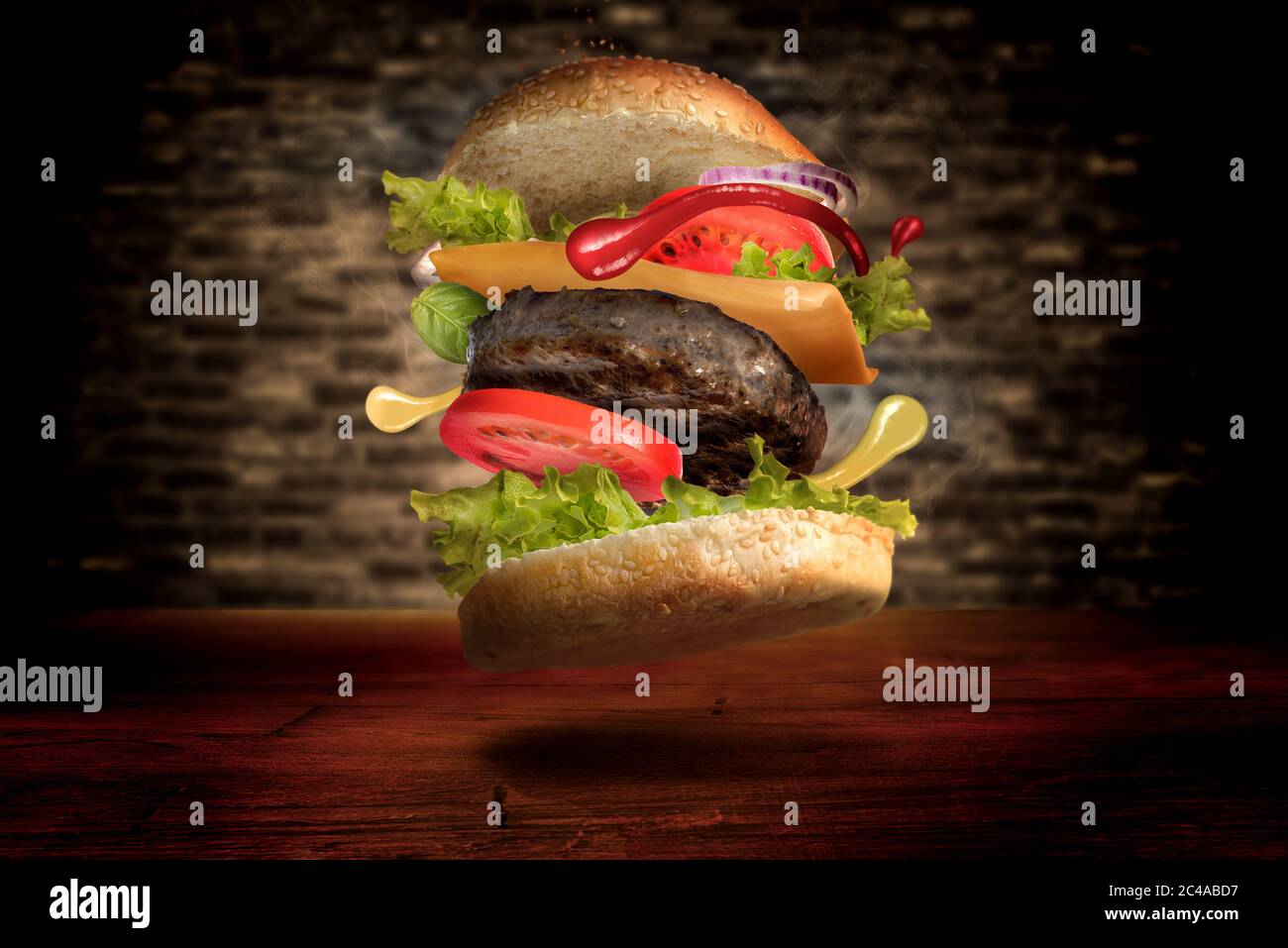 Burger explosion with salad and sauce Stock Photo - Alamy