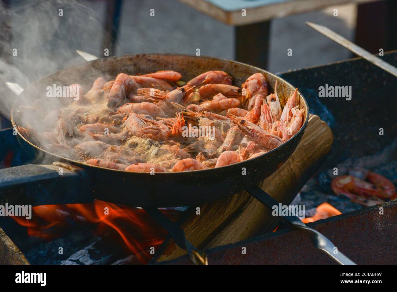 shrimp. Shrimps are cooked in a pan over a fire Stock Photo - Alamy
