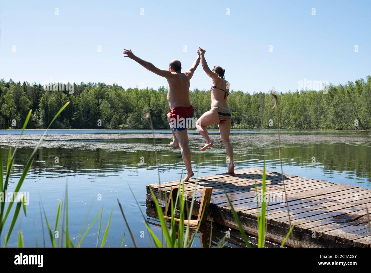 Jump water man woman hi-res stock photography and images - Alamy