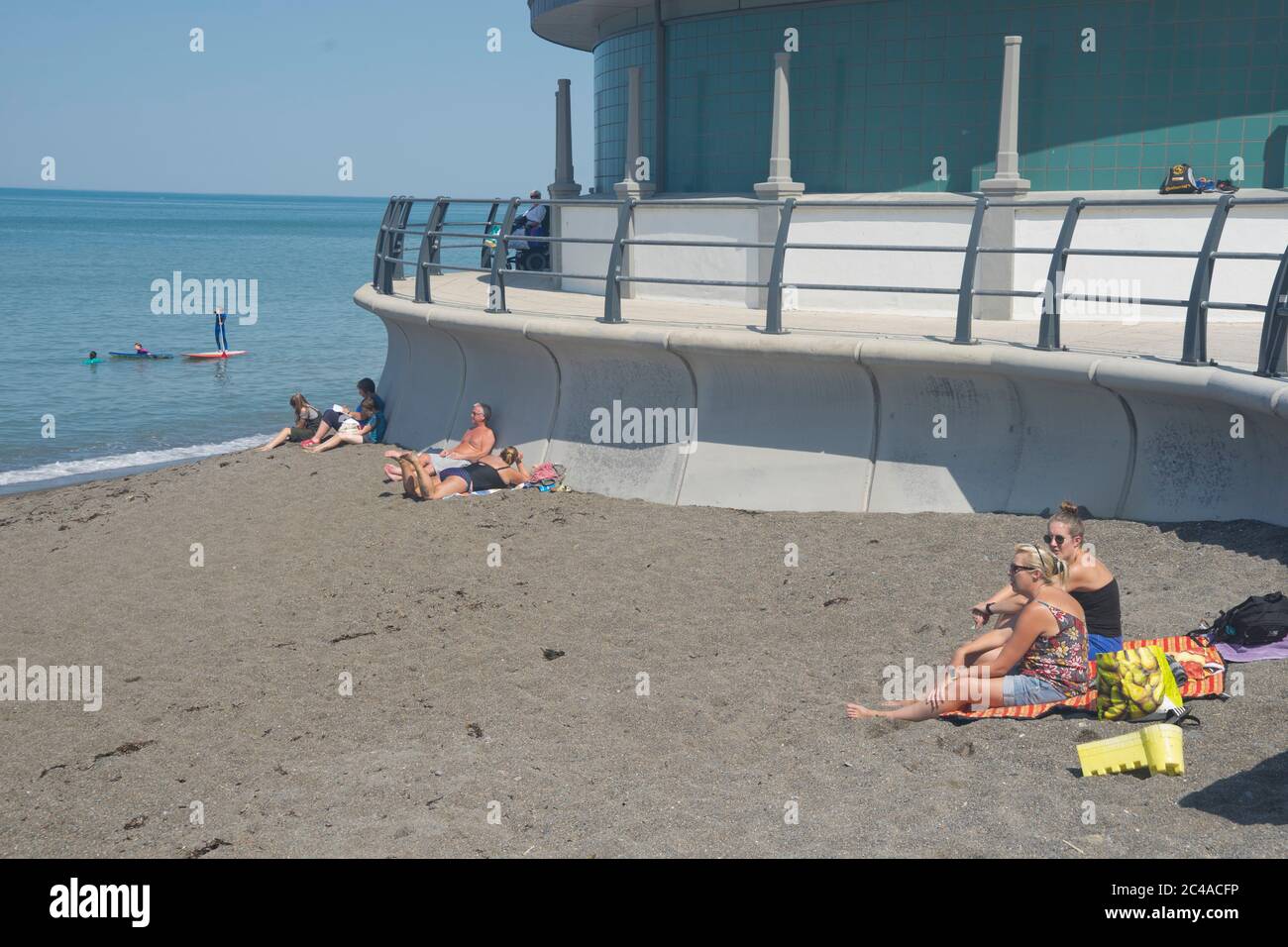 People enjoy the warm Summer sunshine after the Welsh government eased ...