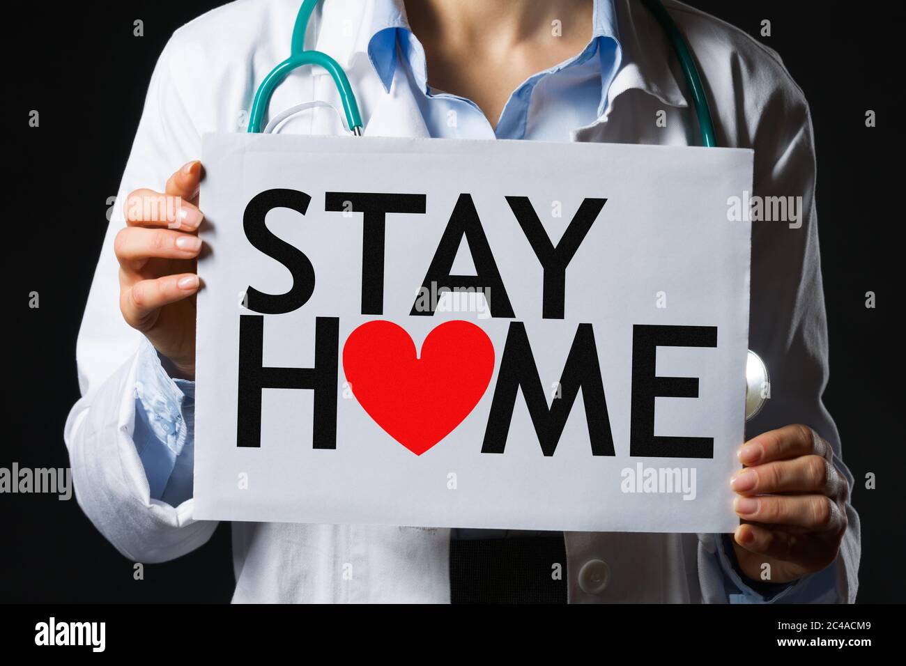 Closeup on medical doctor woman showing blank billboard with stay home ...