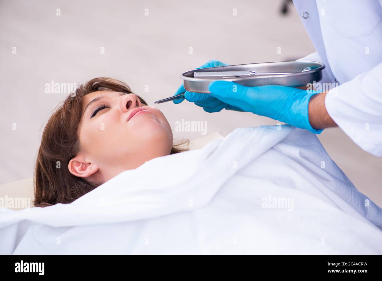 Police coroner examining dead body in morgue Stock Photo - Alamy