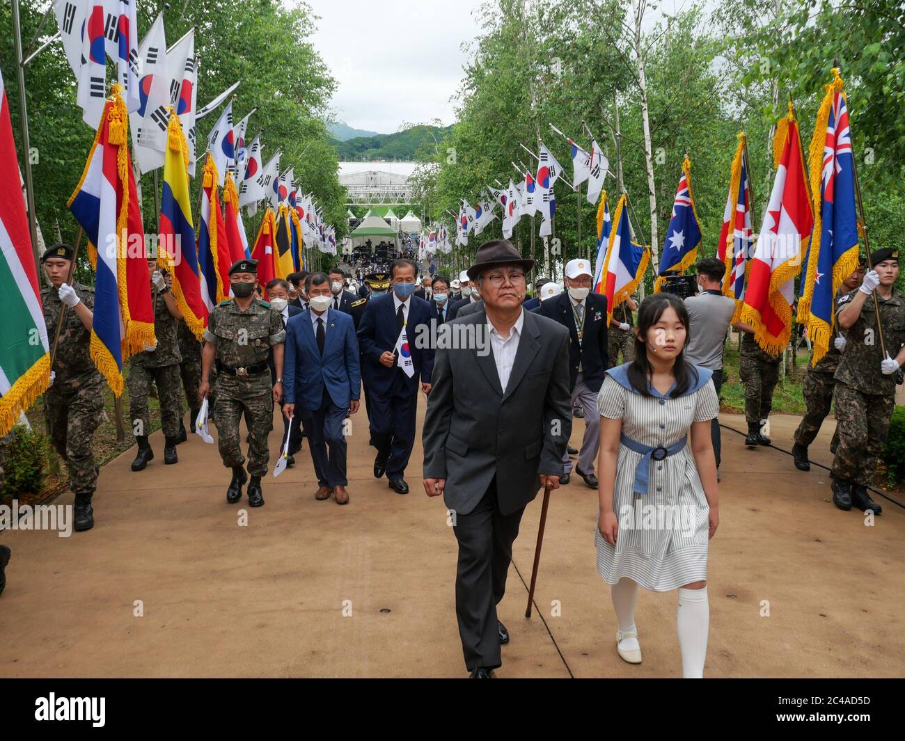 Cheorwon, South Korea. 25th June, 2020. A pair of actors lead a ...