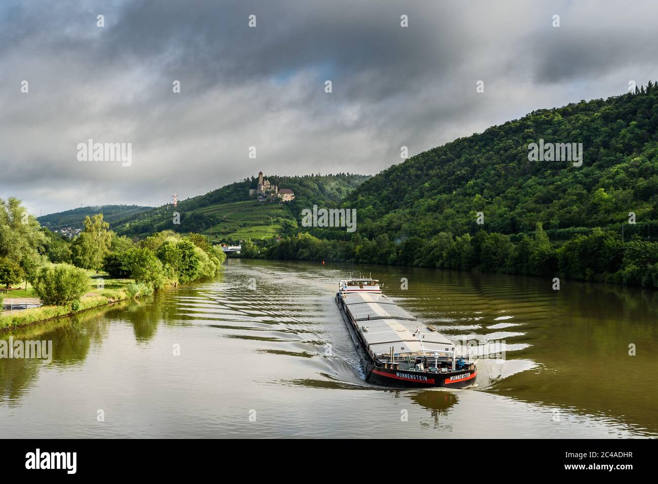 Cargo ship on the Neckar river, Hornberg Castle in background ...