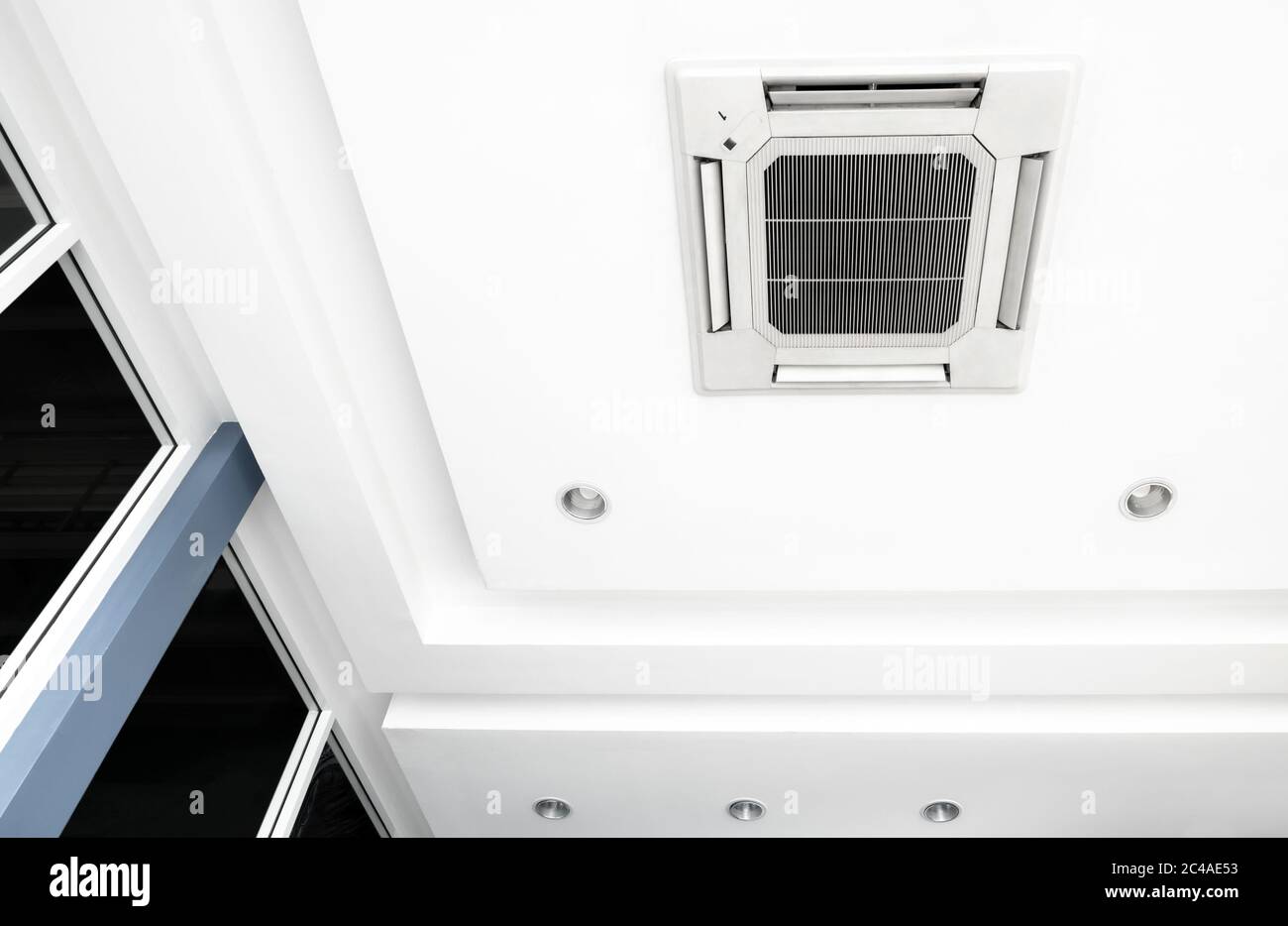 Lighting and ceiling mounted air conditioner on the modern office ...