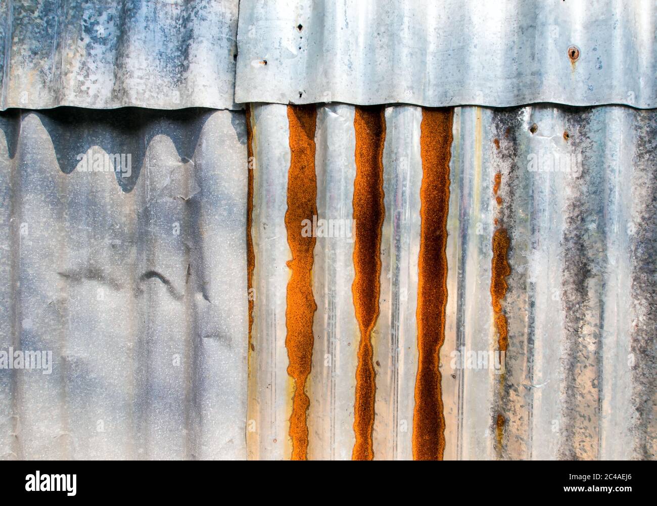 Rusty corrugated galvanized sheet iron fence Stock Photo - Alamy