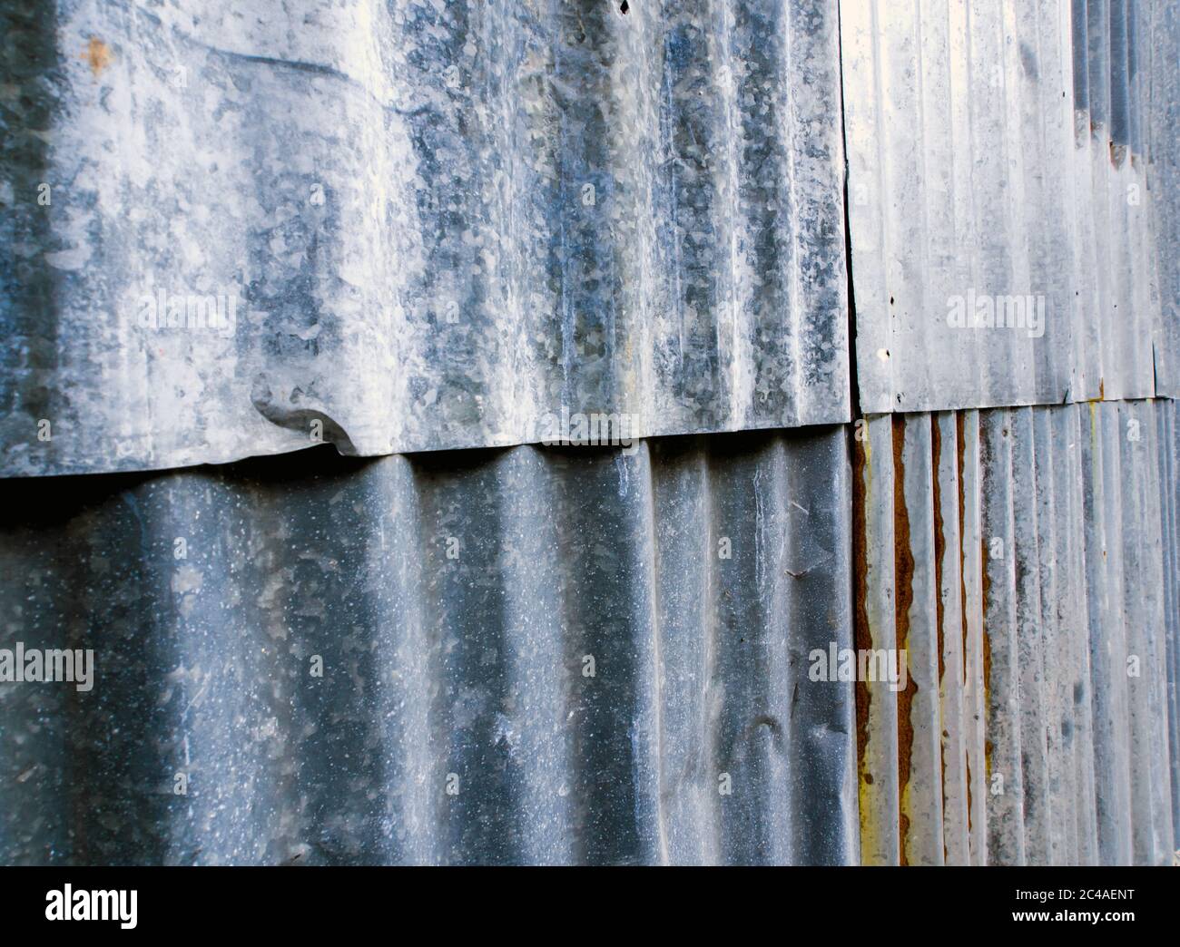 Rusty corrugated galvanized sheet iron fence Stock Photo - Alamy