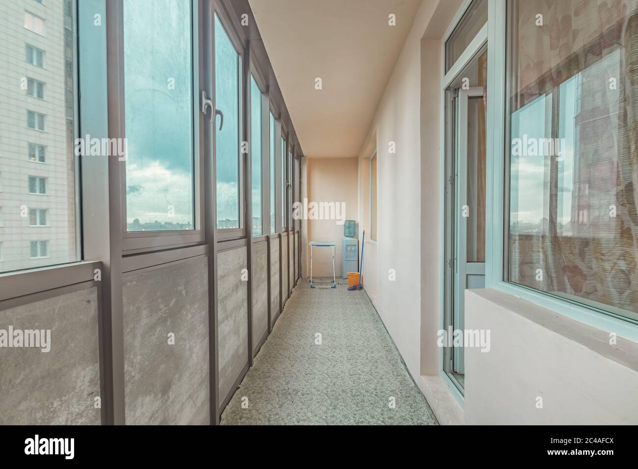 Small old common open balcony interior in high residential apartment ...