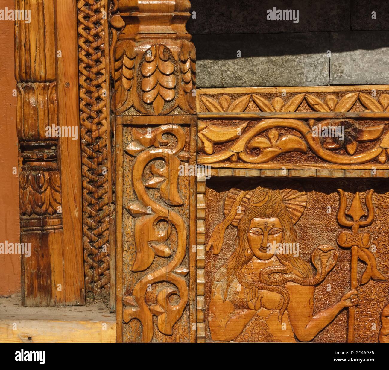 Details of ornate carvings on the wooden doorway of an ancient Hindu ...