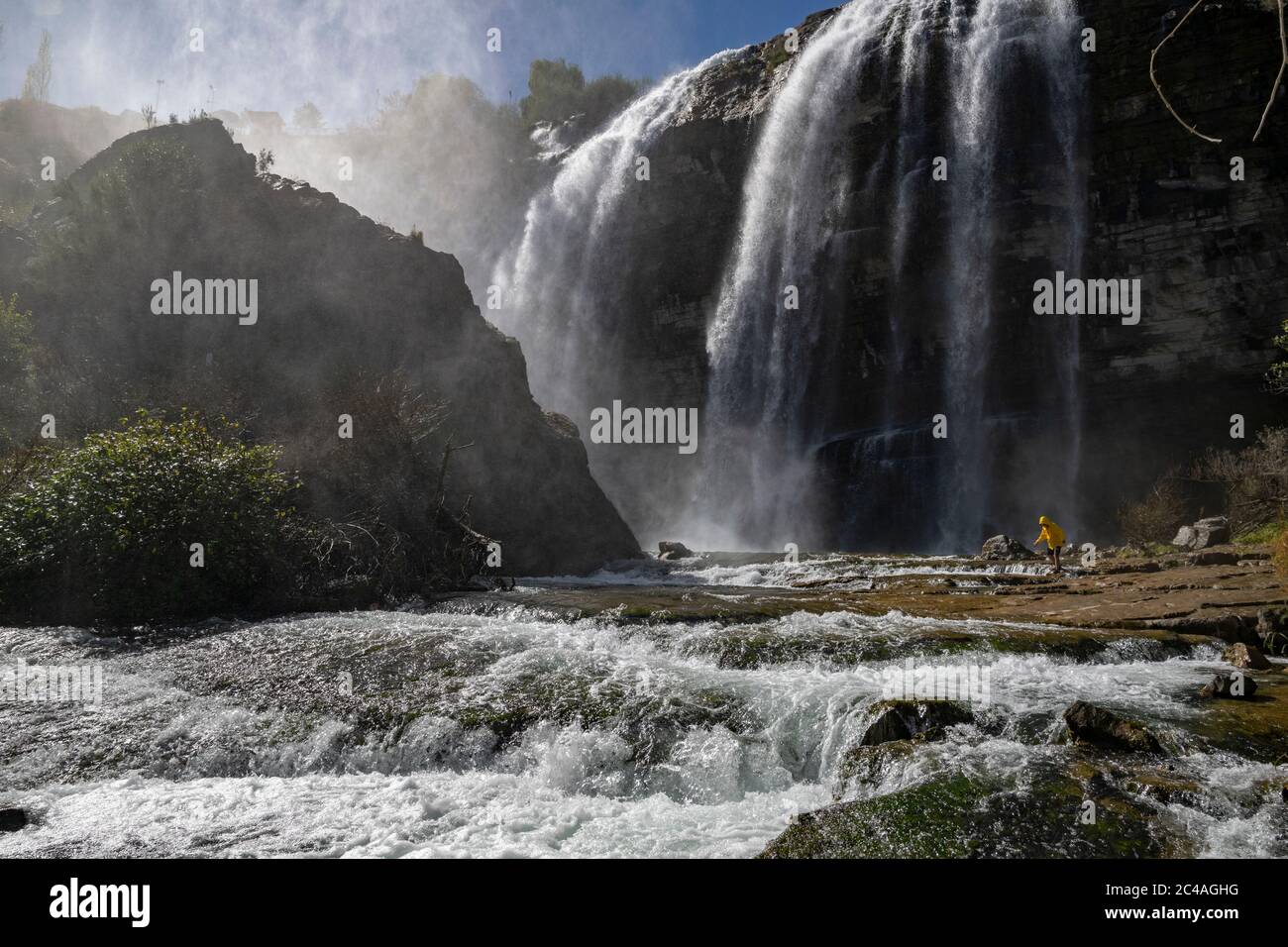 Man walking against the big waterfall in Tortum. Explore the world's ...
