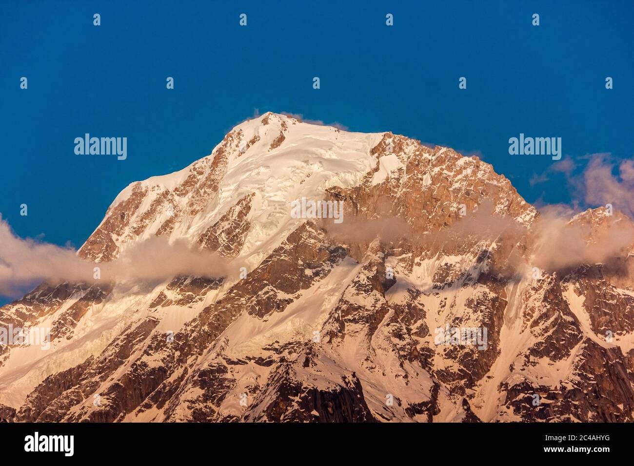 The beautiful view of a snow covered peak in a Himalayan mountain range ...