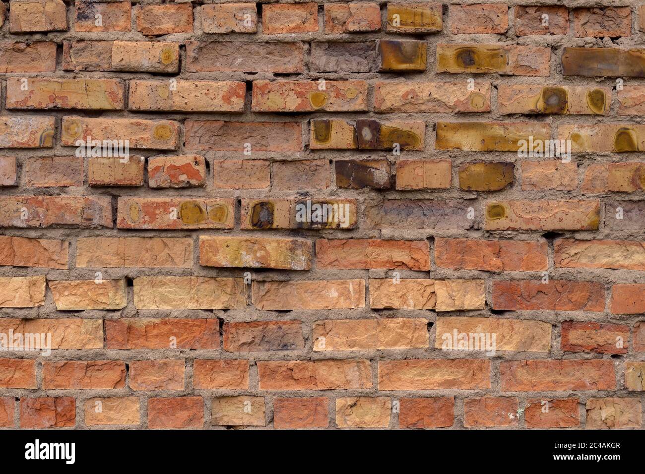 Collapsing red brick wall. The texture of the brickwork. Layered clay ...