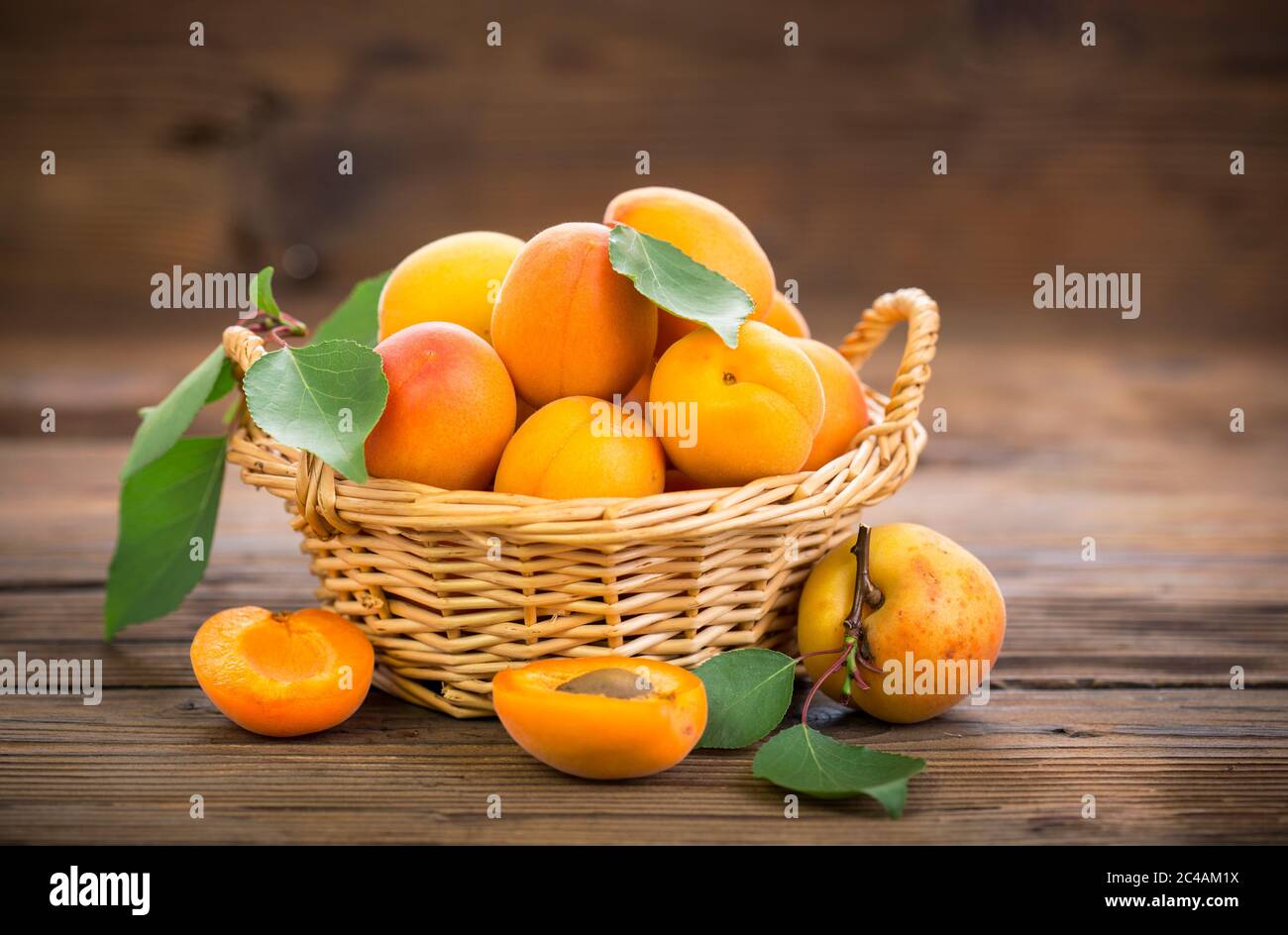 Fresh apricots in the basket Stock Photo - Alamy