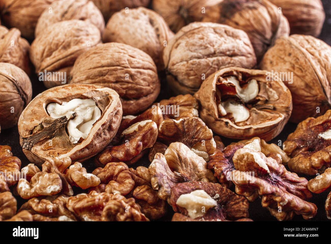 walnut in shells and peeled Stock Photo - Alamy