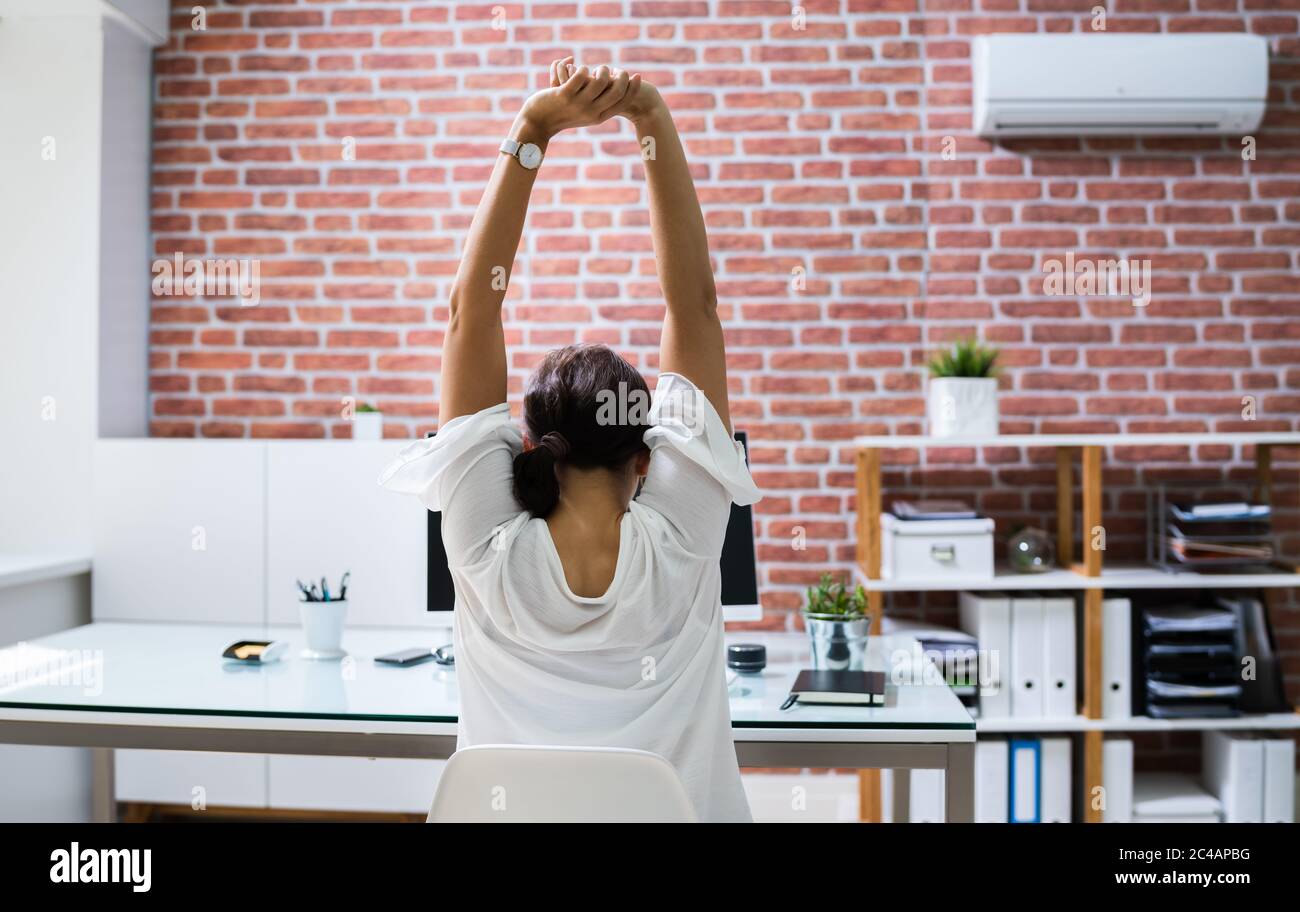 Woman Employee Doing Stretch Yoga Workout Exercise Stock Photo - Alamy