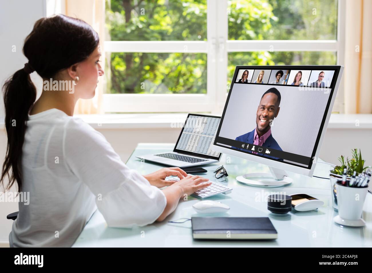 Businesswomen having video conference office hi-res stock photography ...