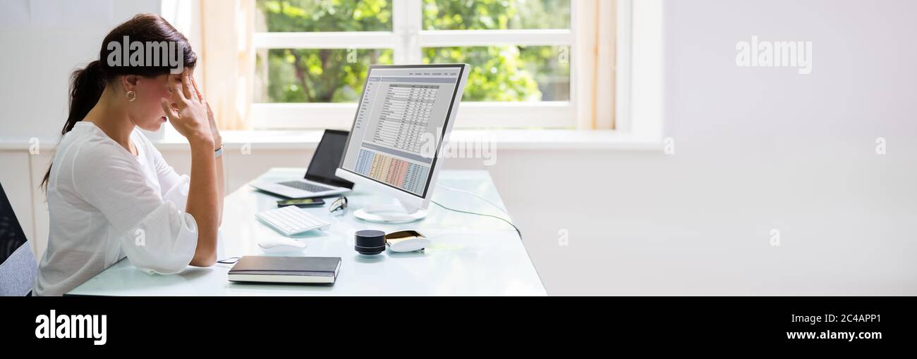 Bad Posture While Using Computer. Stressed Employee Stock Photo - Alamy