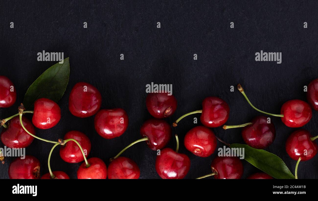 cherry on dark background with copy space. Top view. Flat lay Stock ...