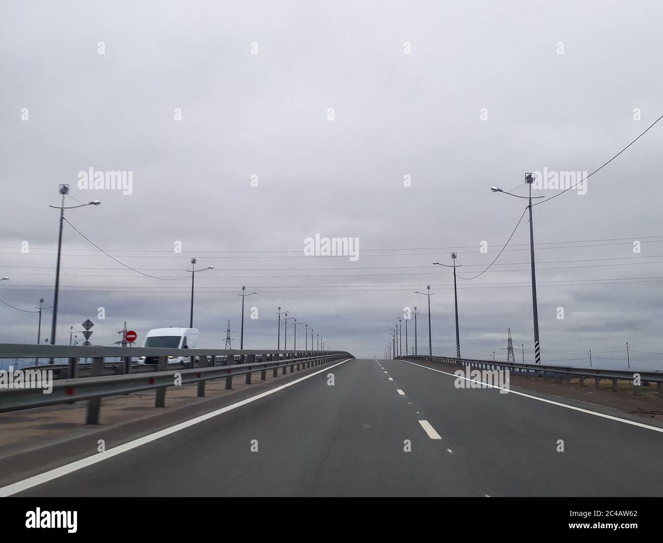 A road or a highway, the highway stretches to the horizon. View from ...