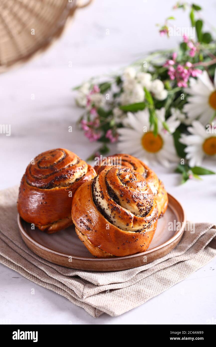 sweet roll poppy seed buns with milk Stock Photo - Alamy
