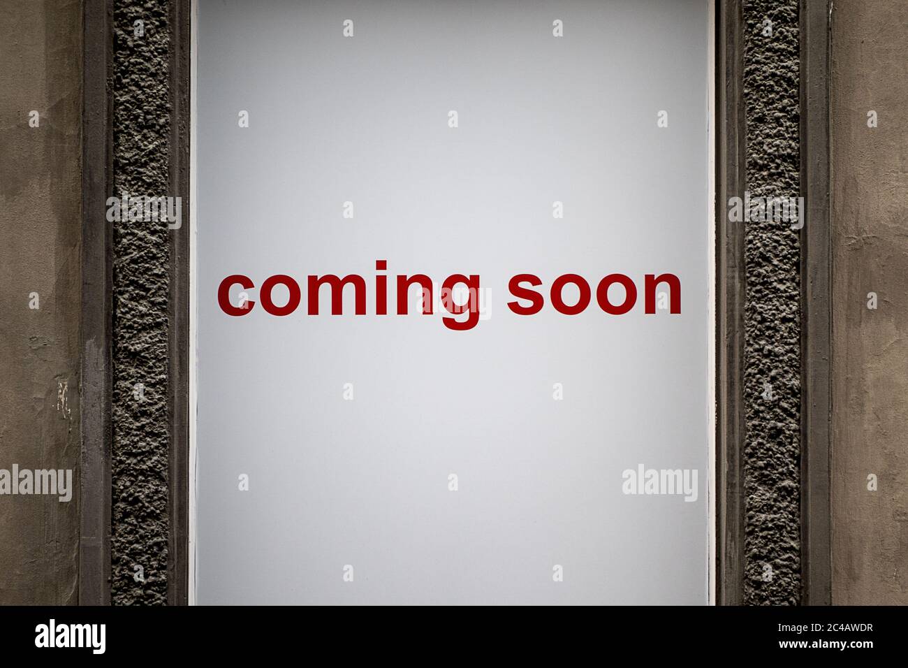 white background with the text coming soon framed by gray brickwork ...