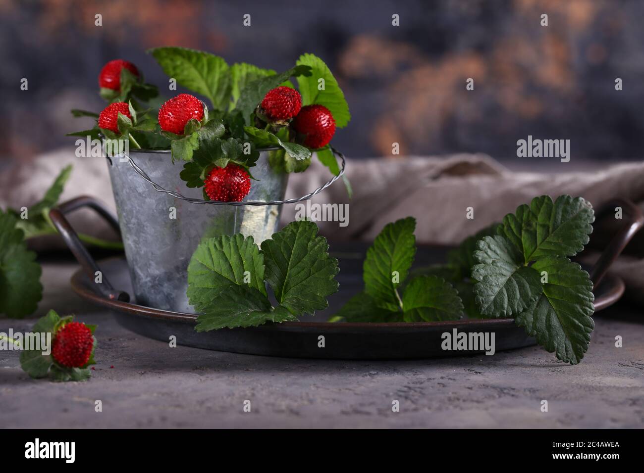 natural wild berry strawberries on a wooden table Stock Photo - Alamy