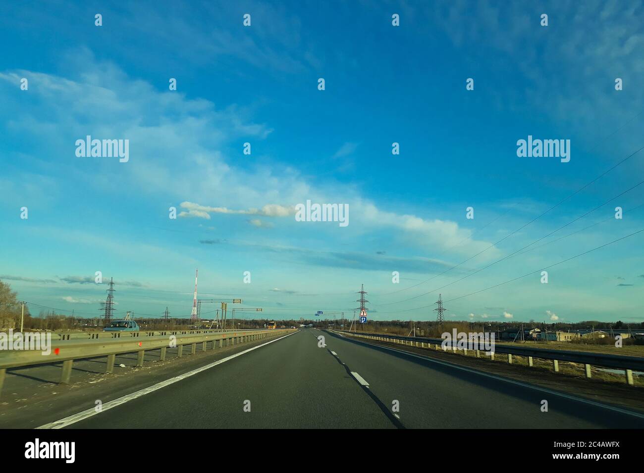 A road or highway leading to the horizon. View from the car window ...