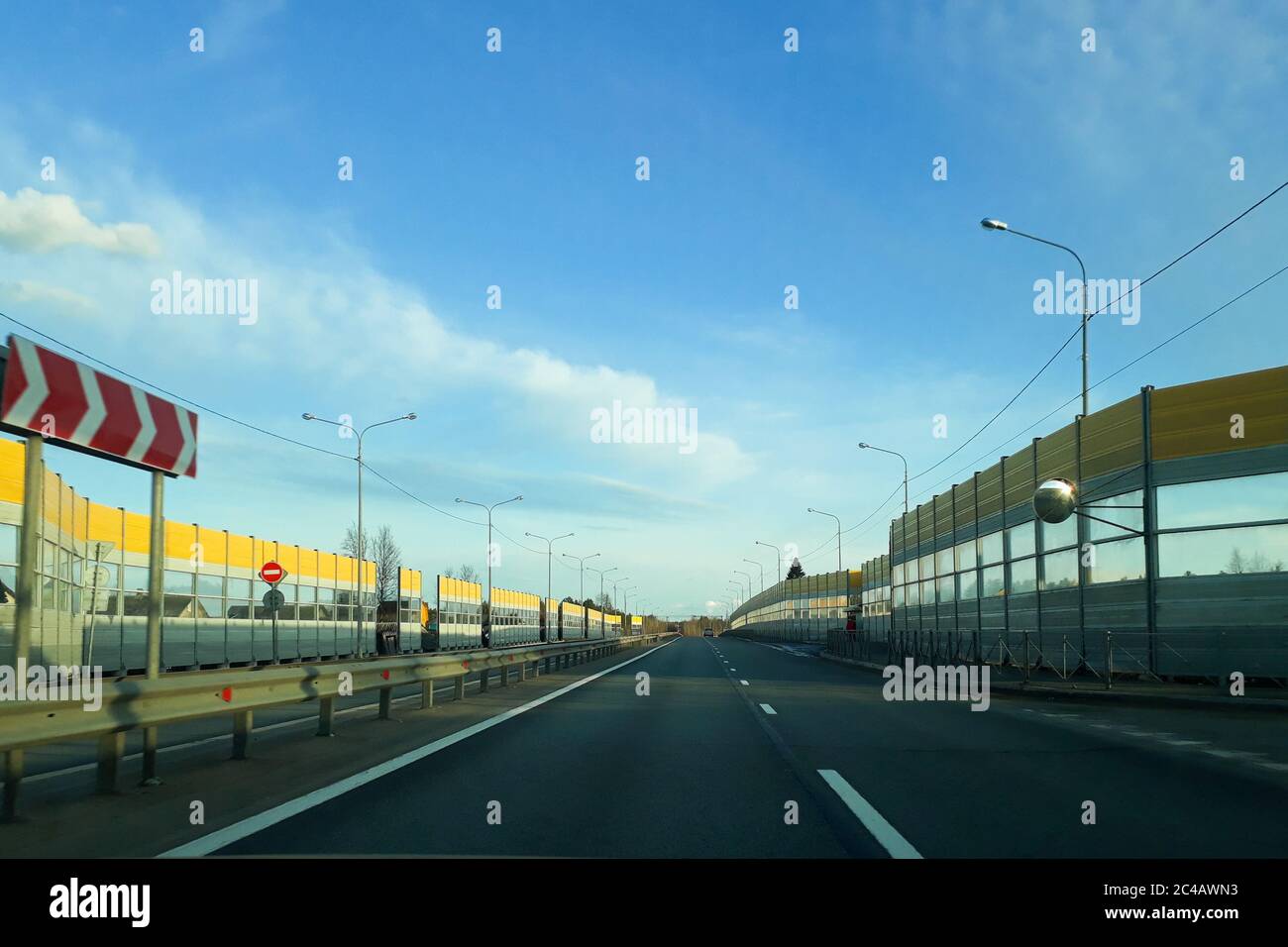 A road or highway leading to the horizon. View from the car window ...