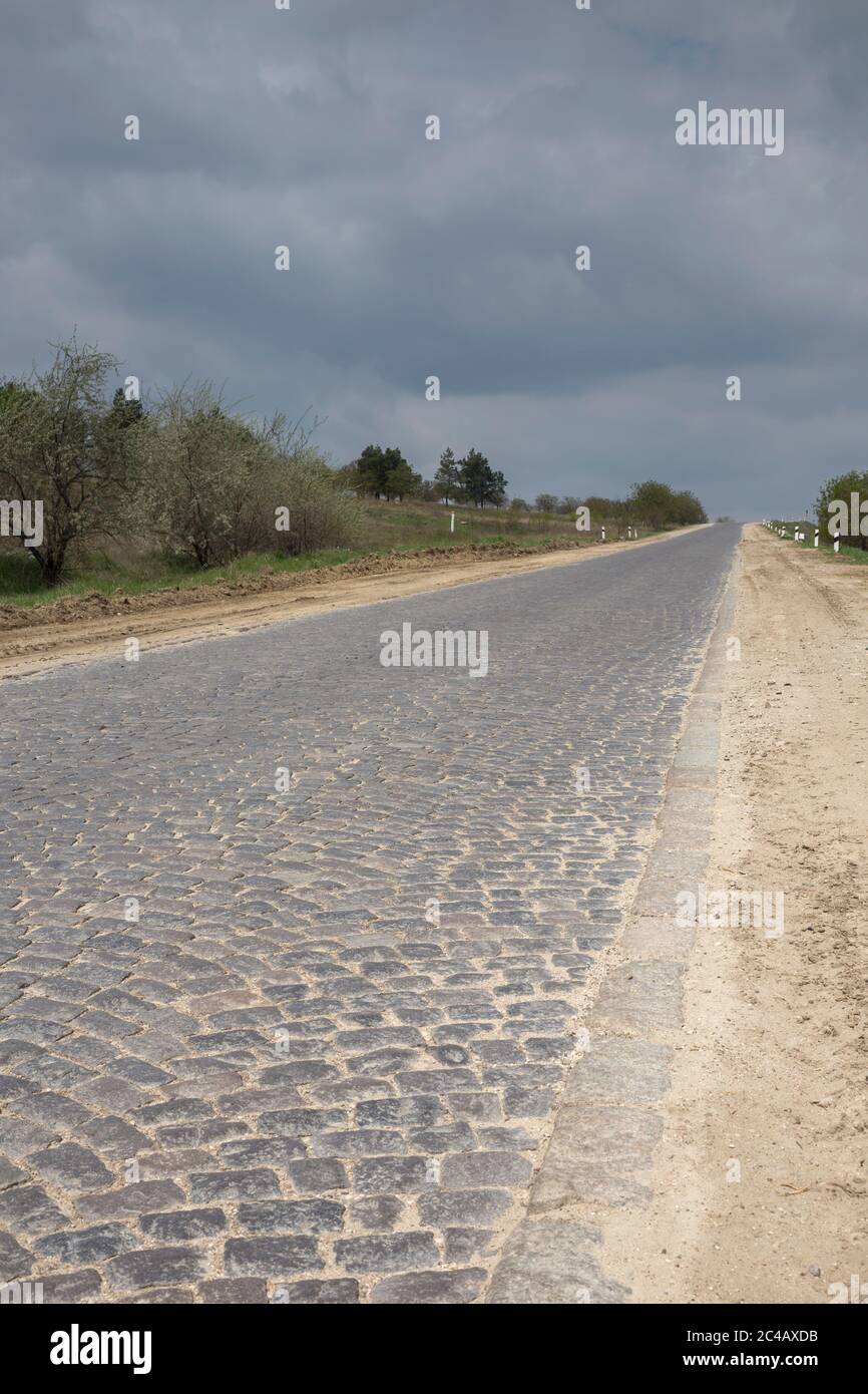 Old cobblestone road hi-res stock photography and images - Alamy