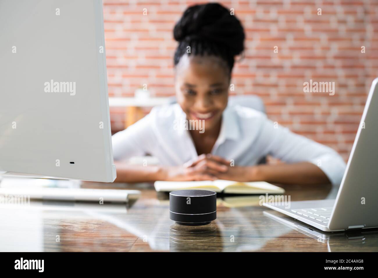 Smart Speaker Voice Assistant And Music Listening Stock Photo - Alamy