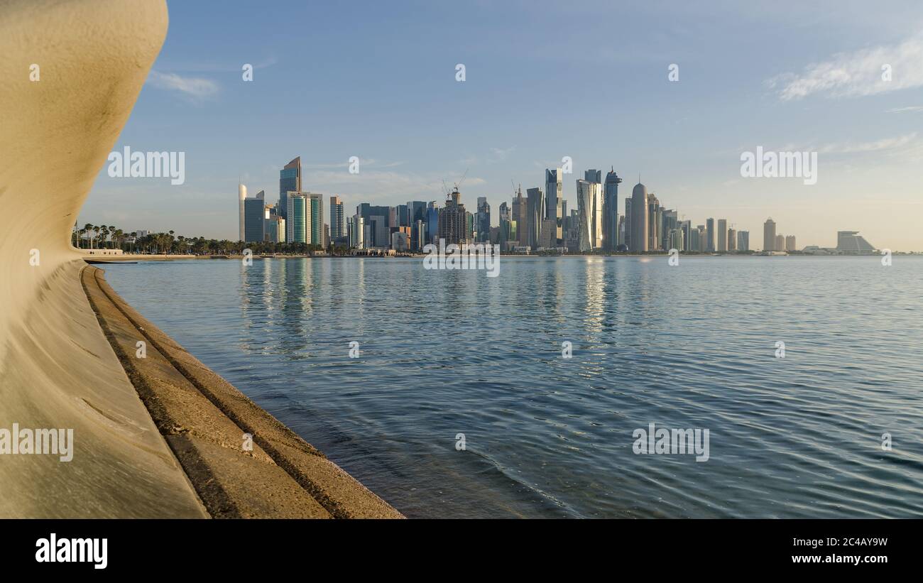 The futuristic urban skyline of Doha, Qatar. Doha is the capital and ...