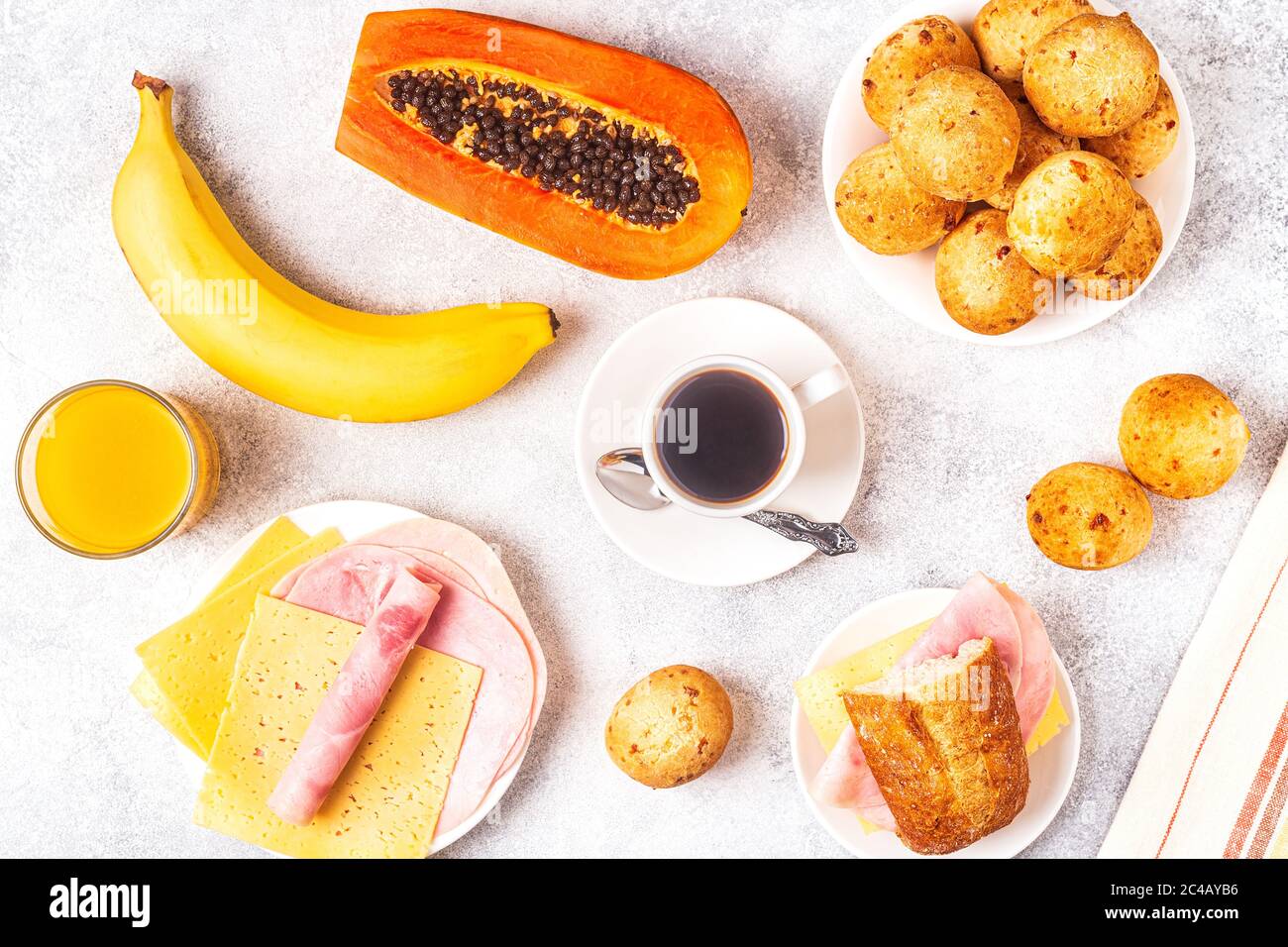 Traditional Brazilian breakfast - cheese bread, coffee, ripe fruit, top ...